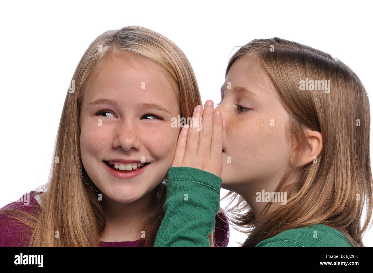 Little girls sharing a secret isolated on a white background Stock ...