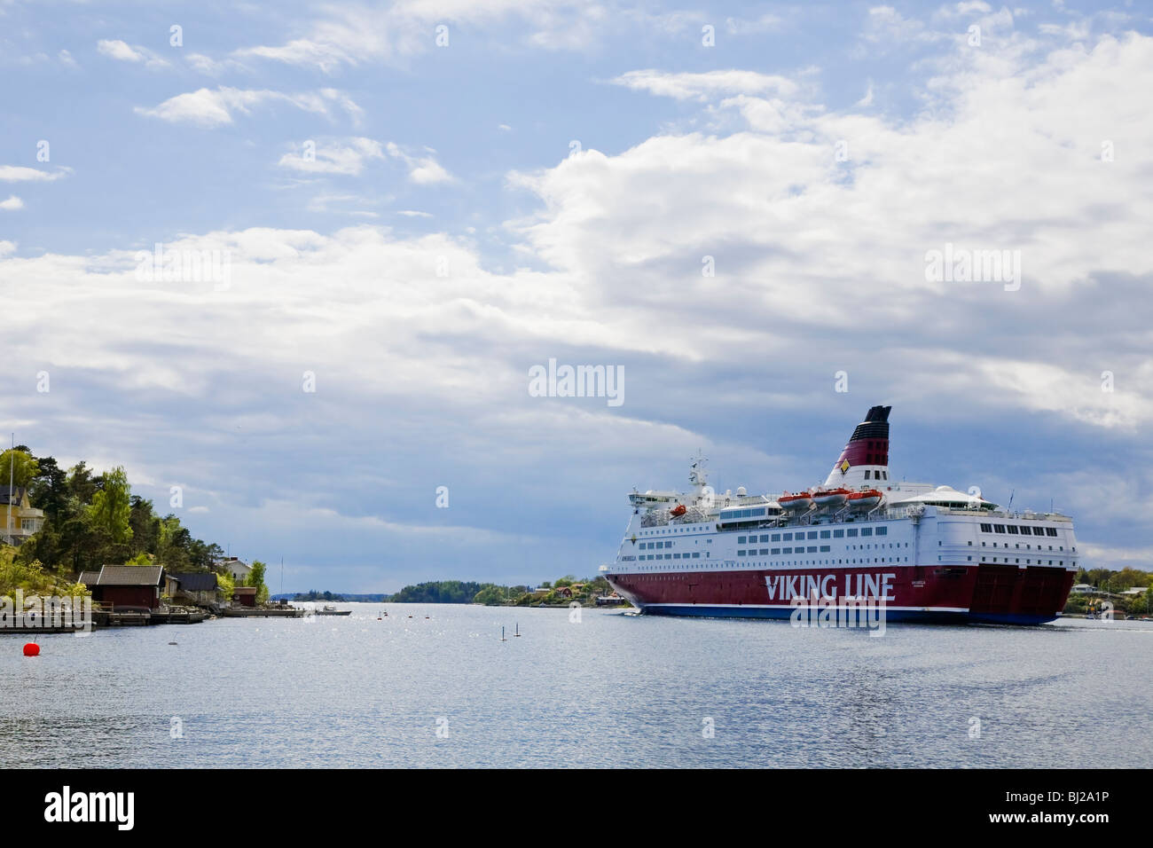 A cruise ship on it's way from Helsinki, Finland, through the Strait of ...