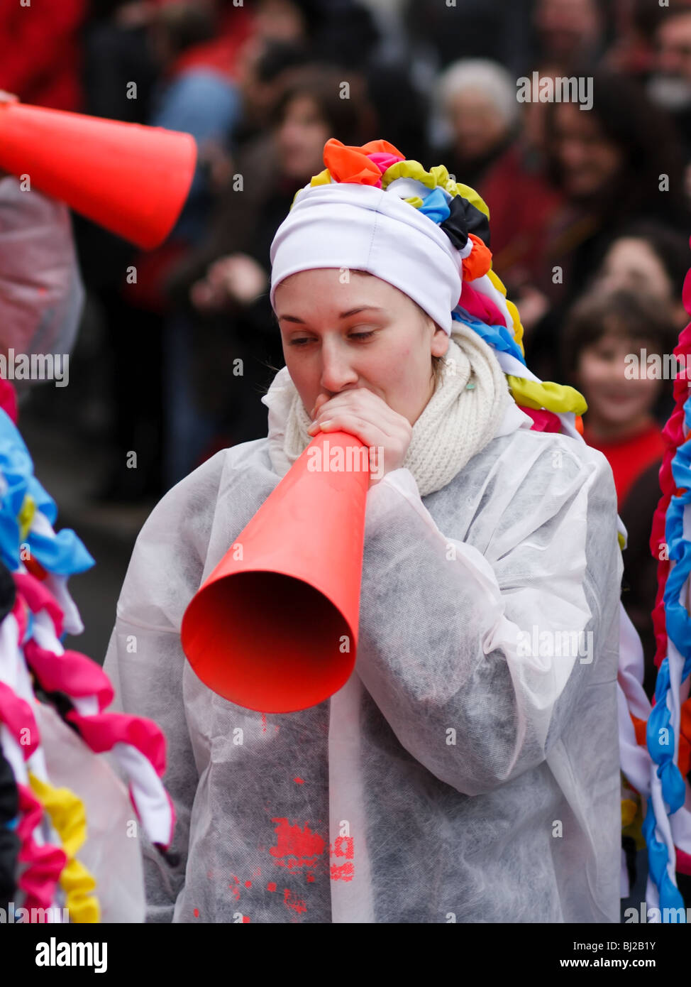 Female singer performing at the carnival parade in the streets of Paris ...