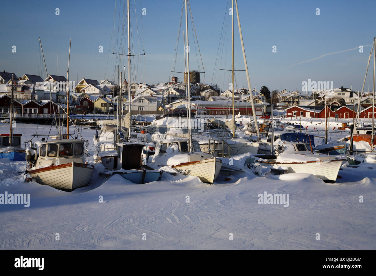 Boat harbor under snow in wintertime Scandinavia Sweden Hönö Island ...