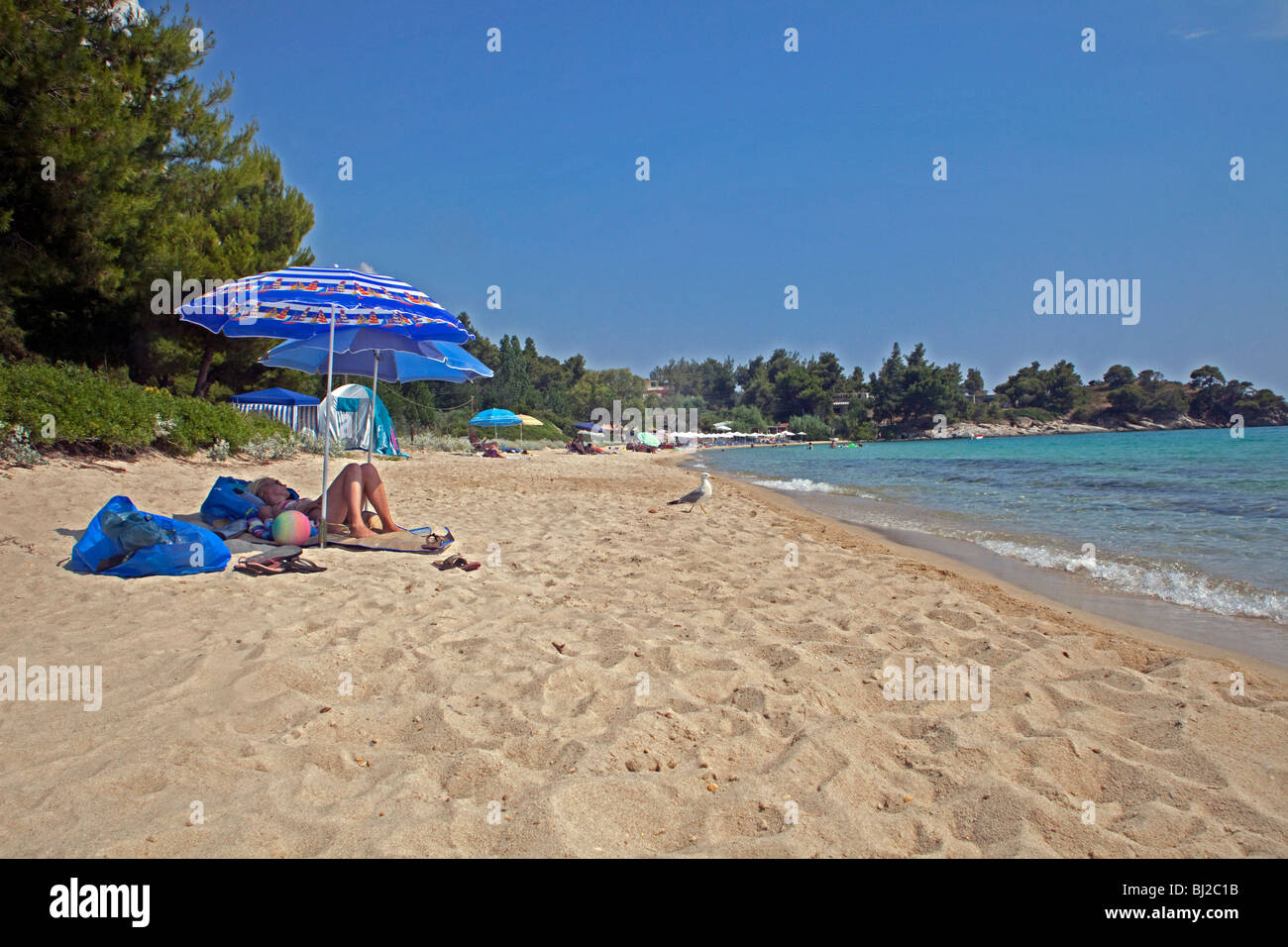 Greece beach sunbathing woman hi-res stock photography and images - Alamy
