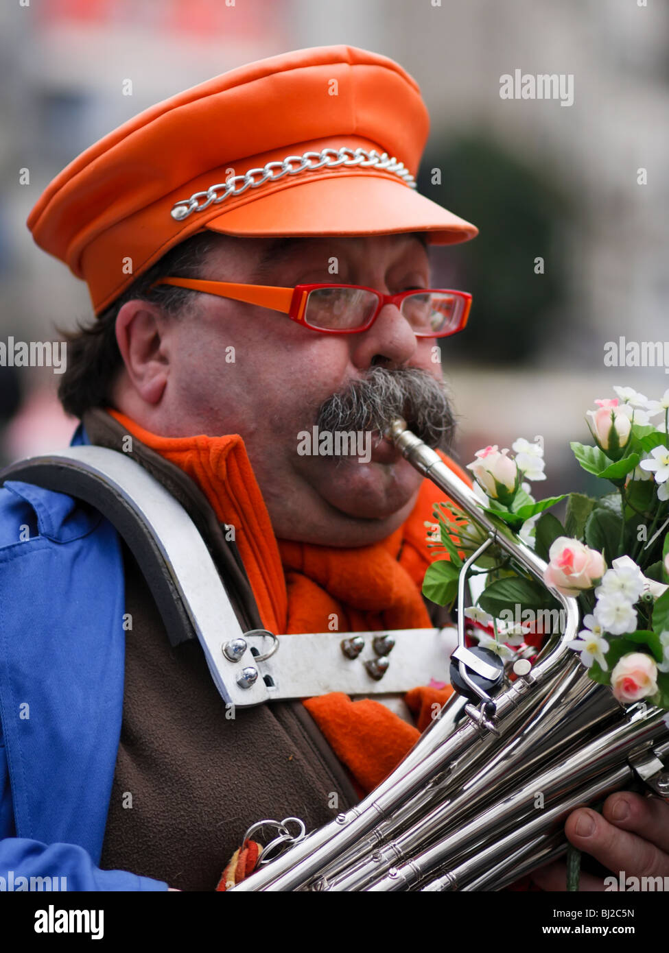 A musician performing at the carnival parade in the streets of Paris ...