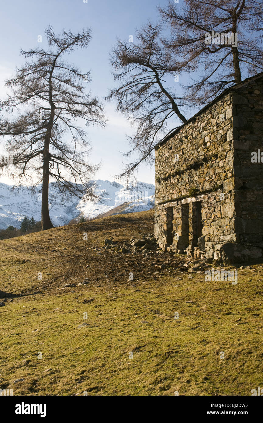 An Old Lakeland Stone Barn with Snow Covered Cumbrian Mountains near ...