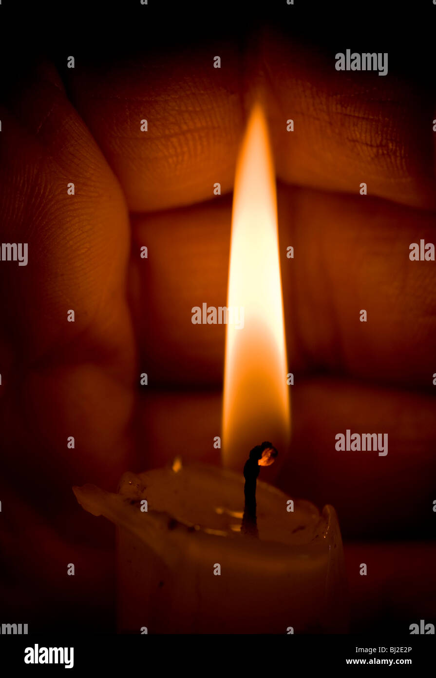 Hand protecting candle light hi-res stock photography and images - Alamy