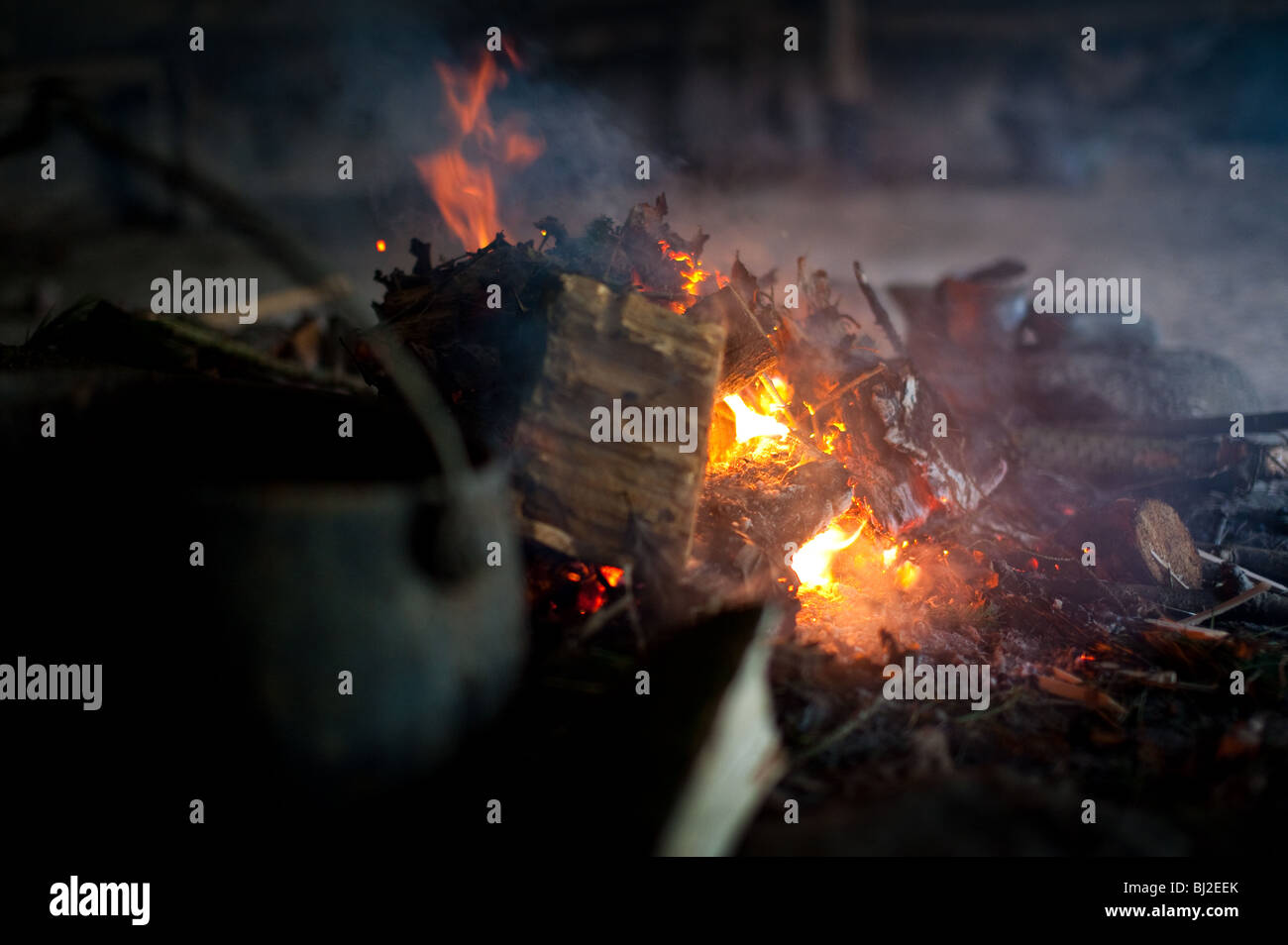 Old style cooking using iron age pots and a fire Stock Photo - Alamy