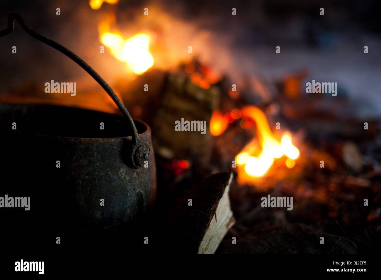 Old style cooking using iron age pots and a fire Stock Photo - Alamy