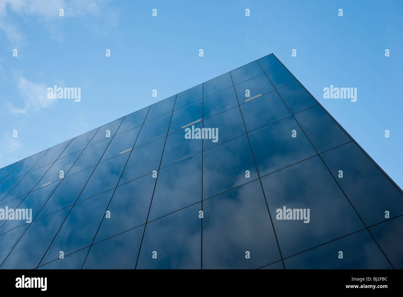 Modern glass office block window against sky with reflection Stock ...