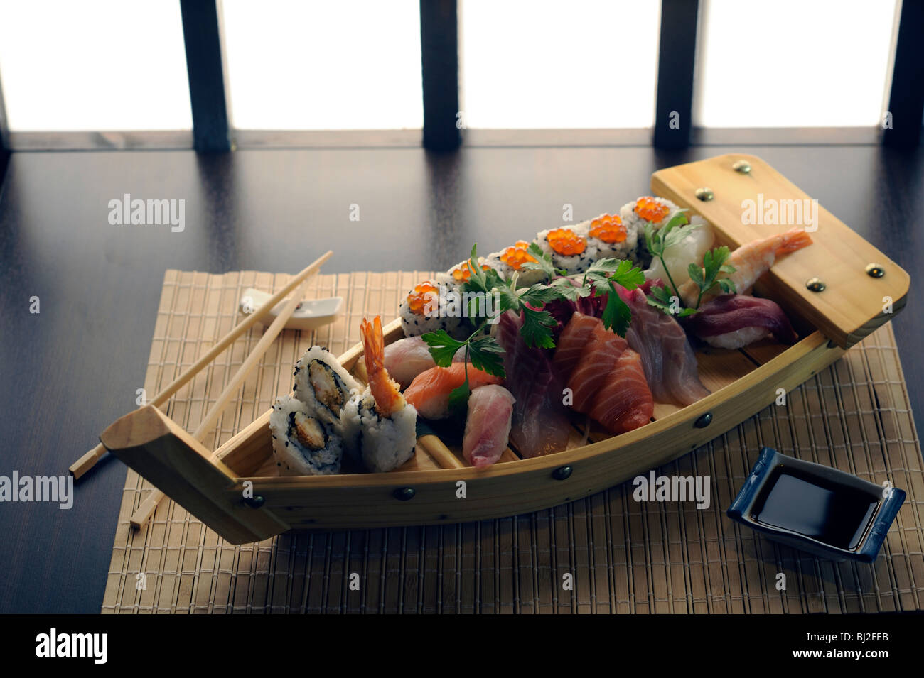 A boat of sushi in a table of elegant Japanese restaurant Stock Photo ...