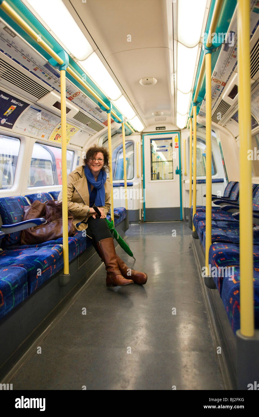 Woman sitting in metro carriage hi-res stock photography and images - Alamy
