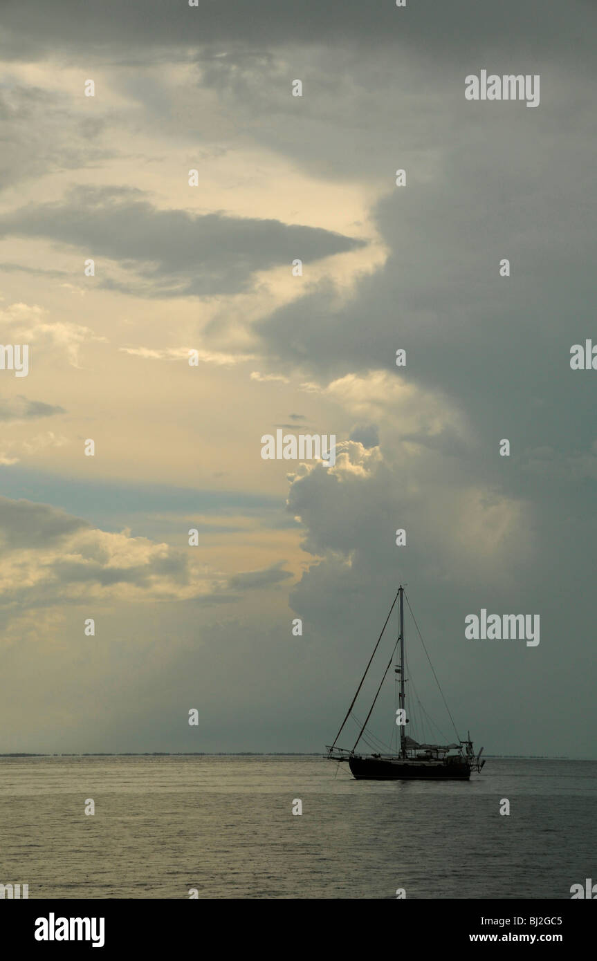 Moored for the night on a mooring buoy on a yacht in the Bahamas. Storm ...