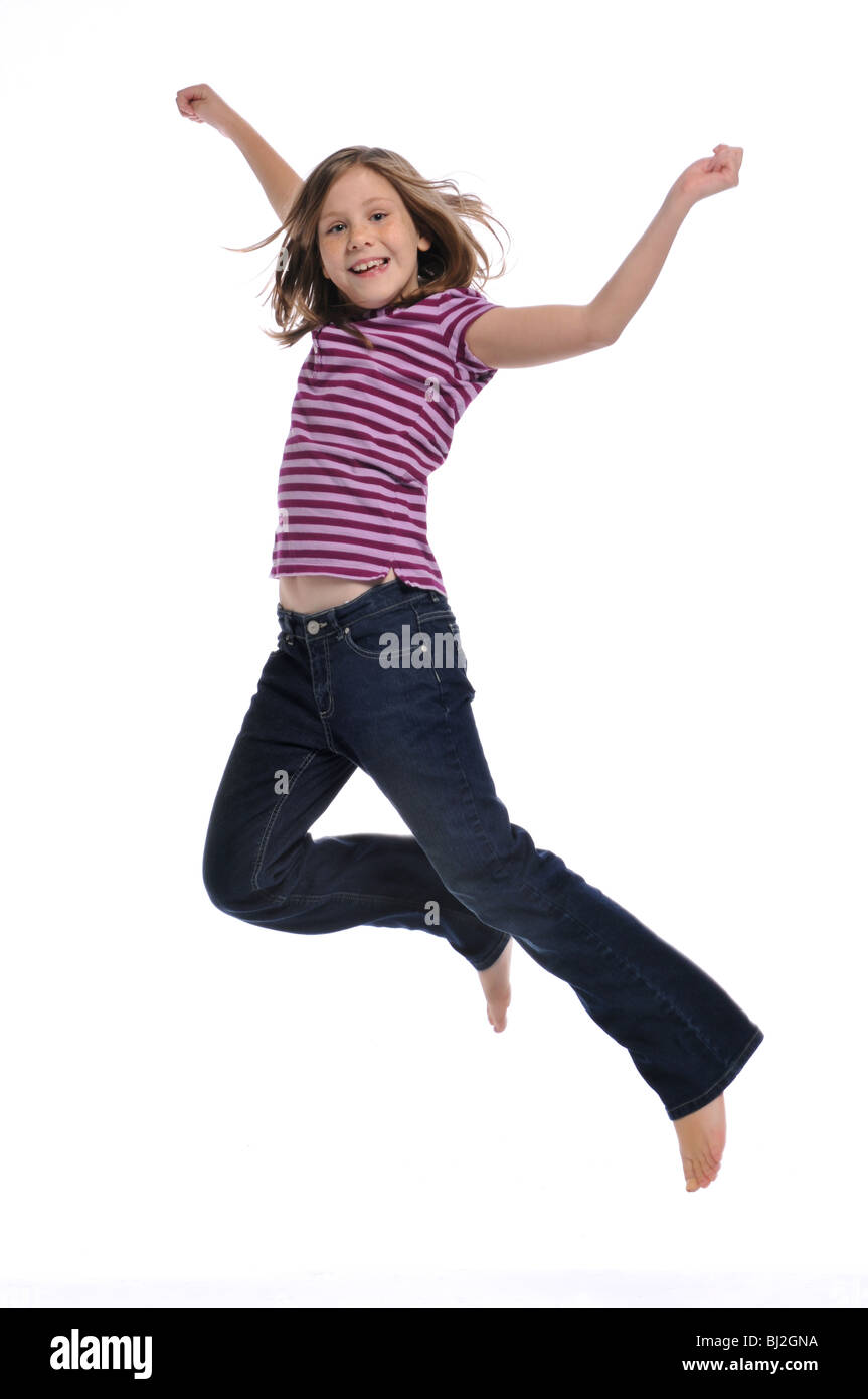 Little girl jumping and having fun isolated on a white background Stock ...