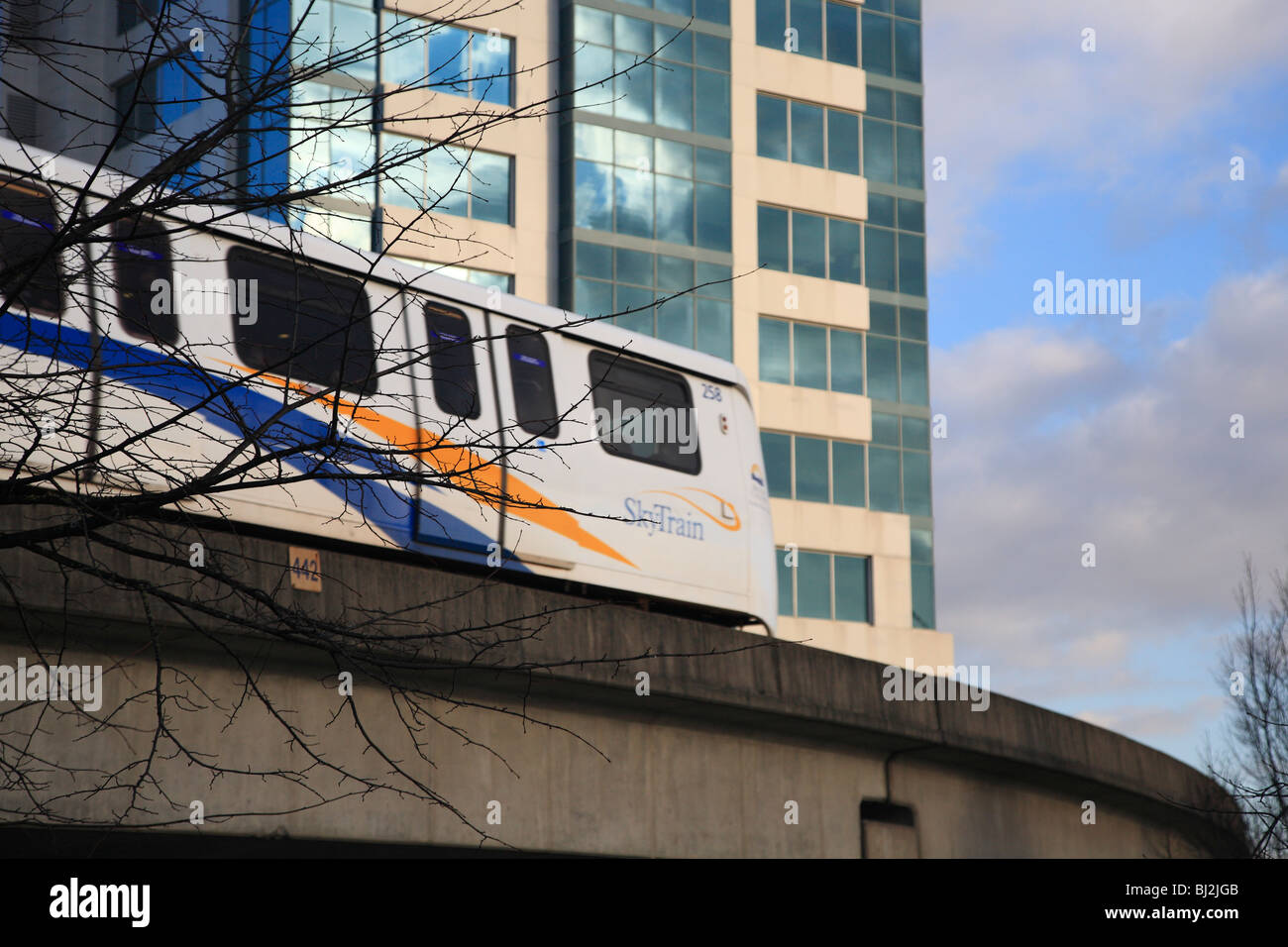 Skytrain light rapid transit with hi rises, Vancouver, British Columbia ...