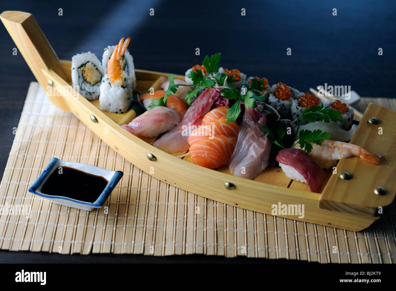A boat of sushi in a table of elegant Japanese restaurant Stock Photo ...