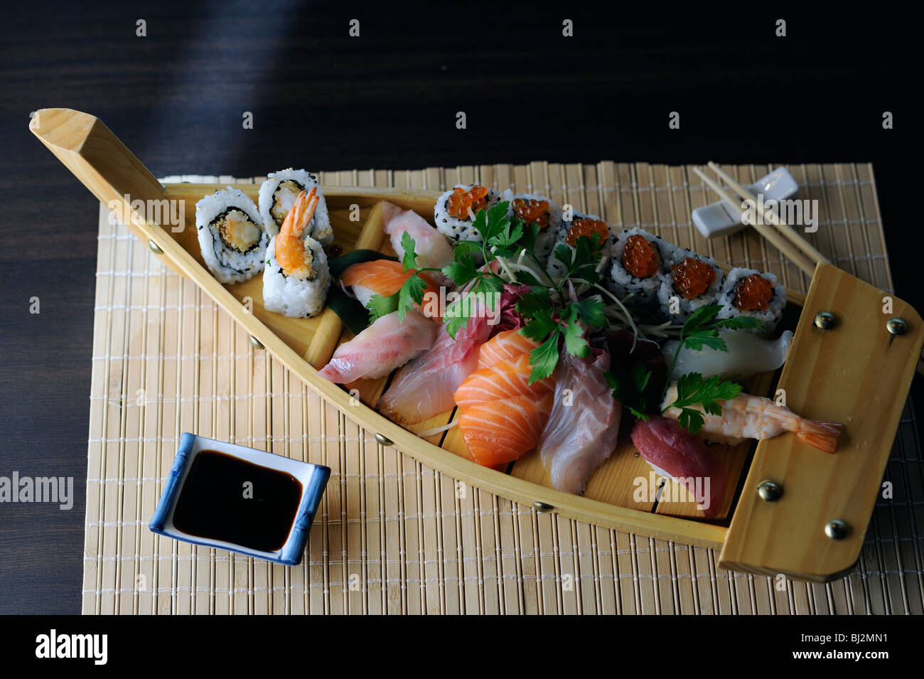 A boat of sushi in a table of elegant Japanese restaurant Stock Photo ...