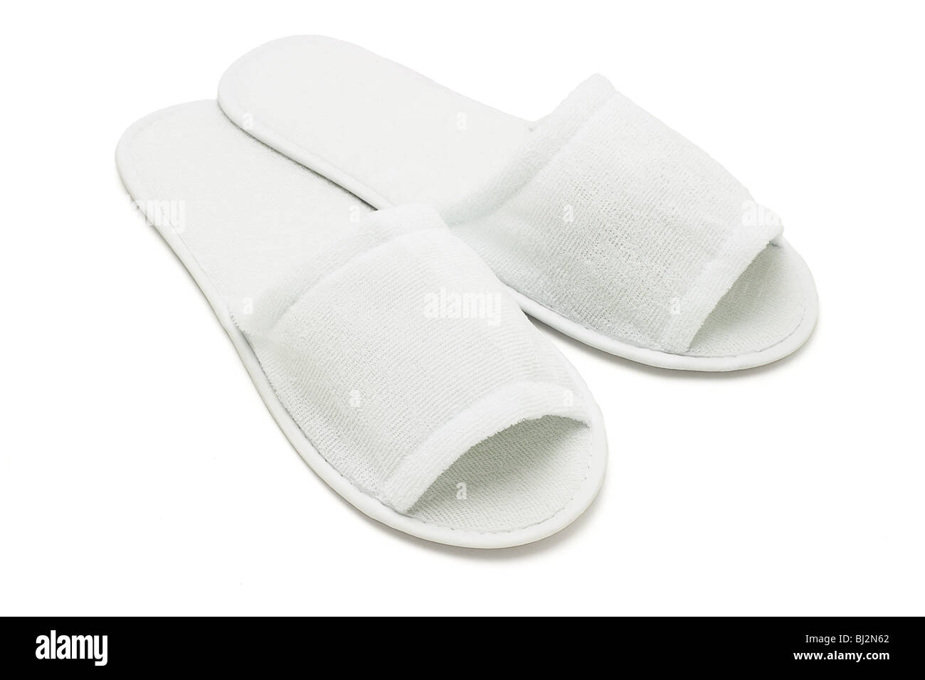 White casual home slippers on white background Stock Photo - Alamy
