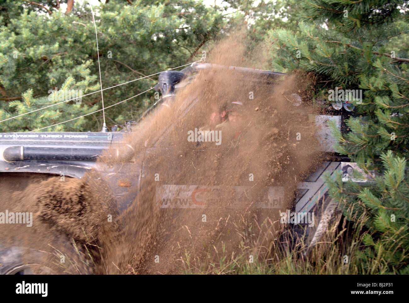 Nissan Patrol front wheel soil spray Stock Photo - Alamy
