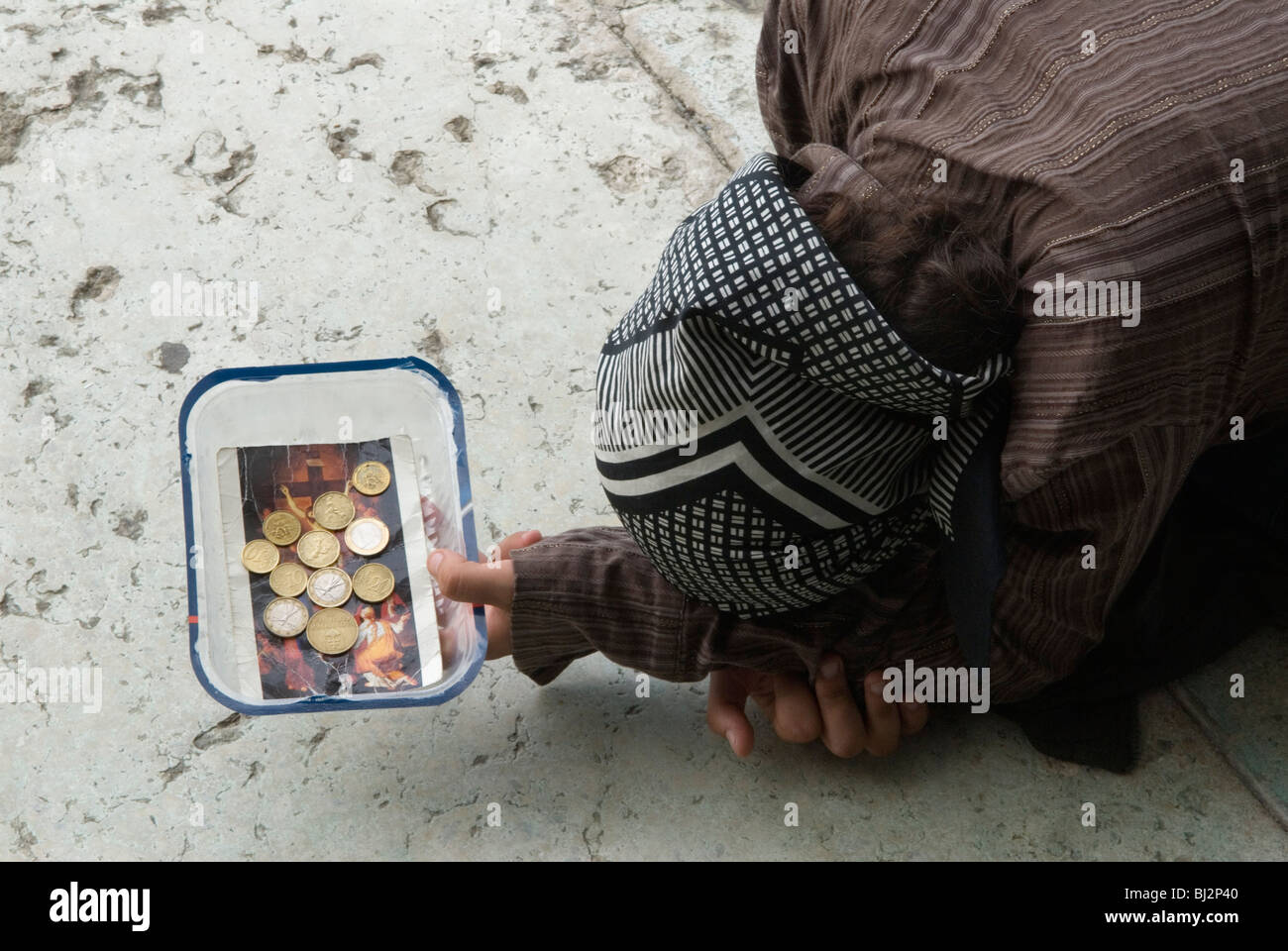 Lying deceitful fake poverty young Roma woman dressed as an old Italian ...
