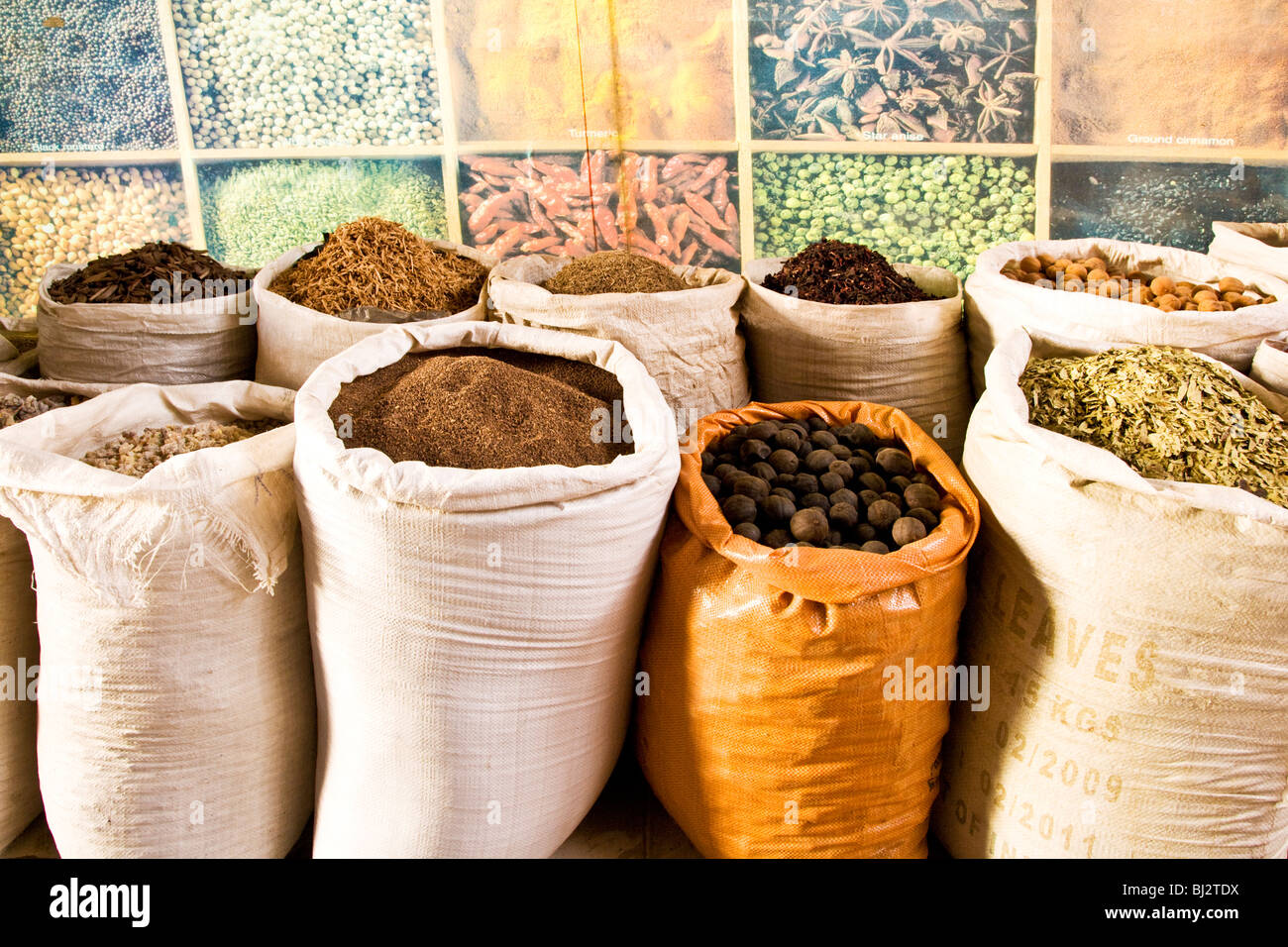 Arabian spices on display in sacks outside a shop in the spice souk in ...