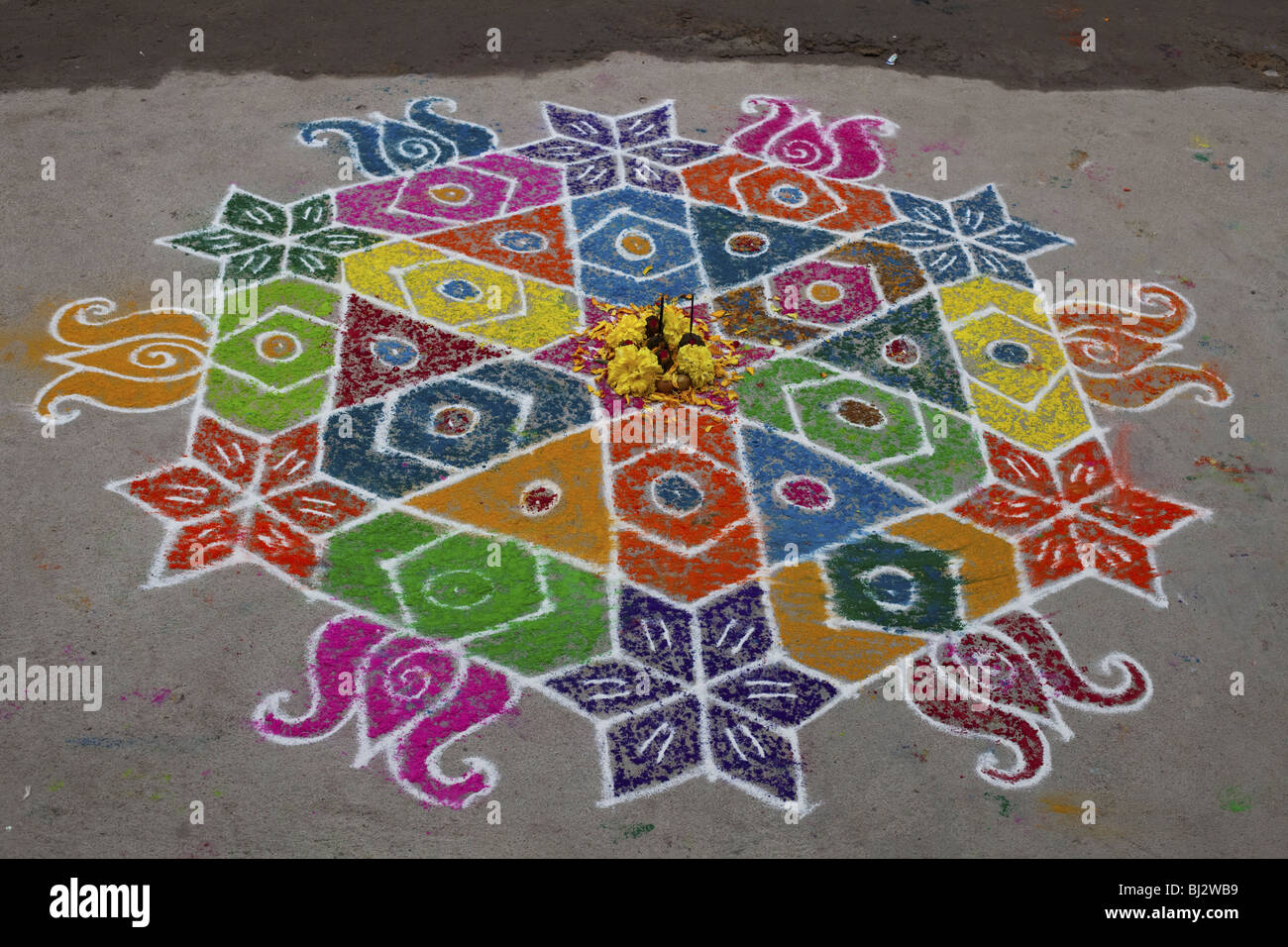 Rangoli festival designs in an Indian street made at the Hindu festival ...
