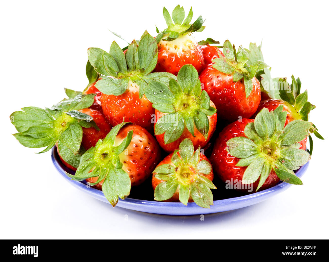 Strawberry on the plate isolated on white background Stock Photo - Alamy