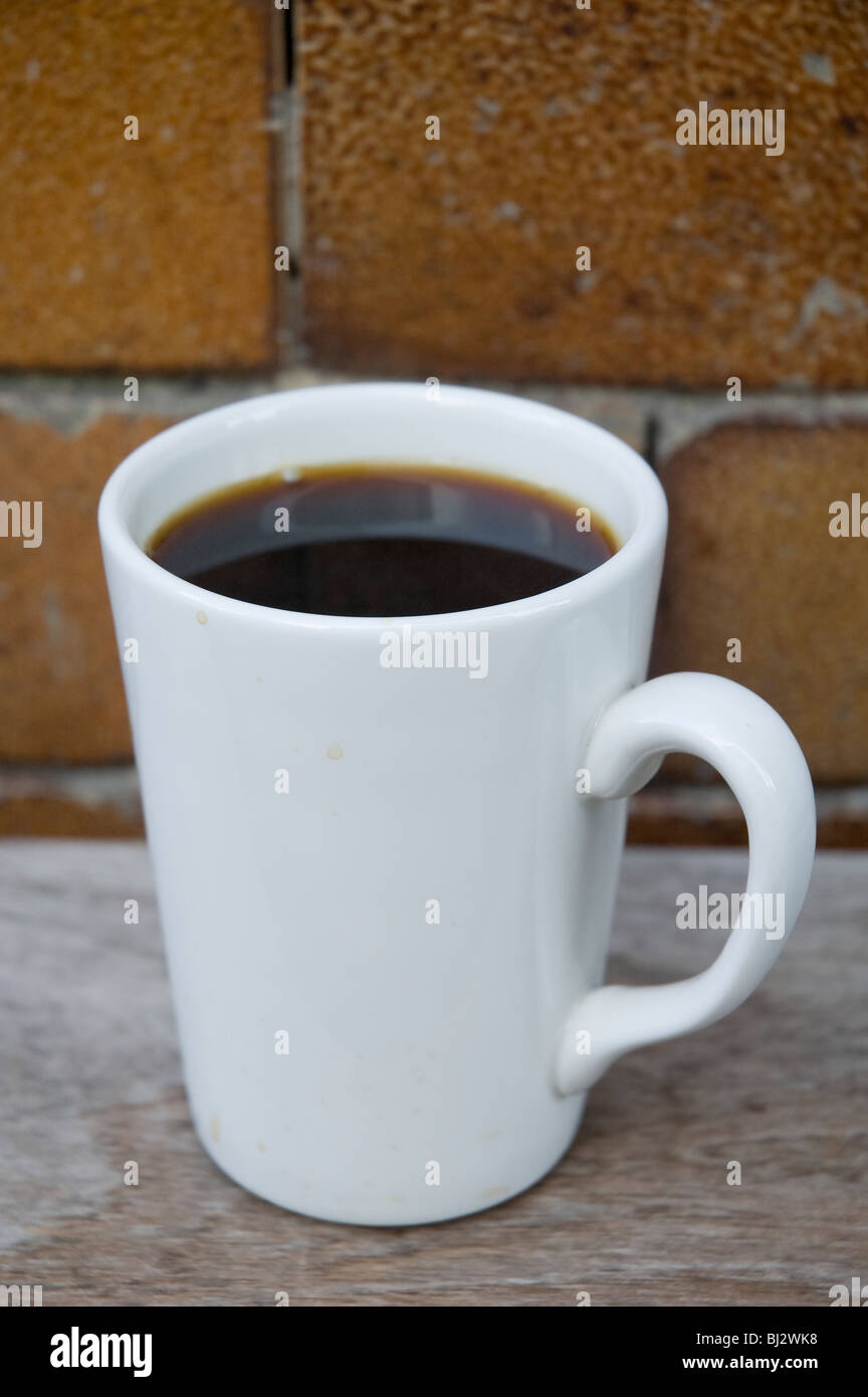 mug of coffee on bench Stock Photo - Alamy