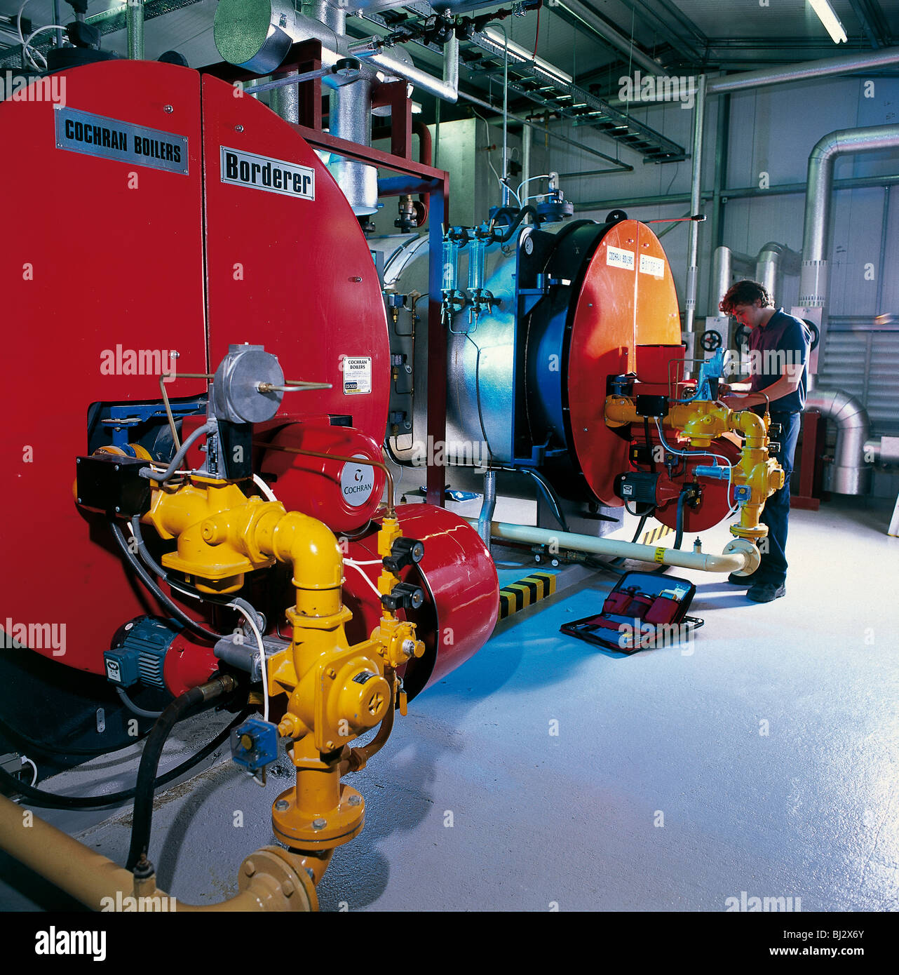 Heating engineer working on Industrial Plant room boilers Stock Photo ...