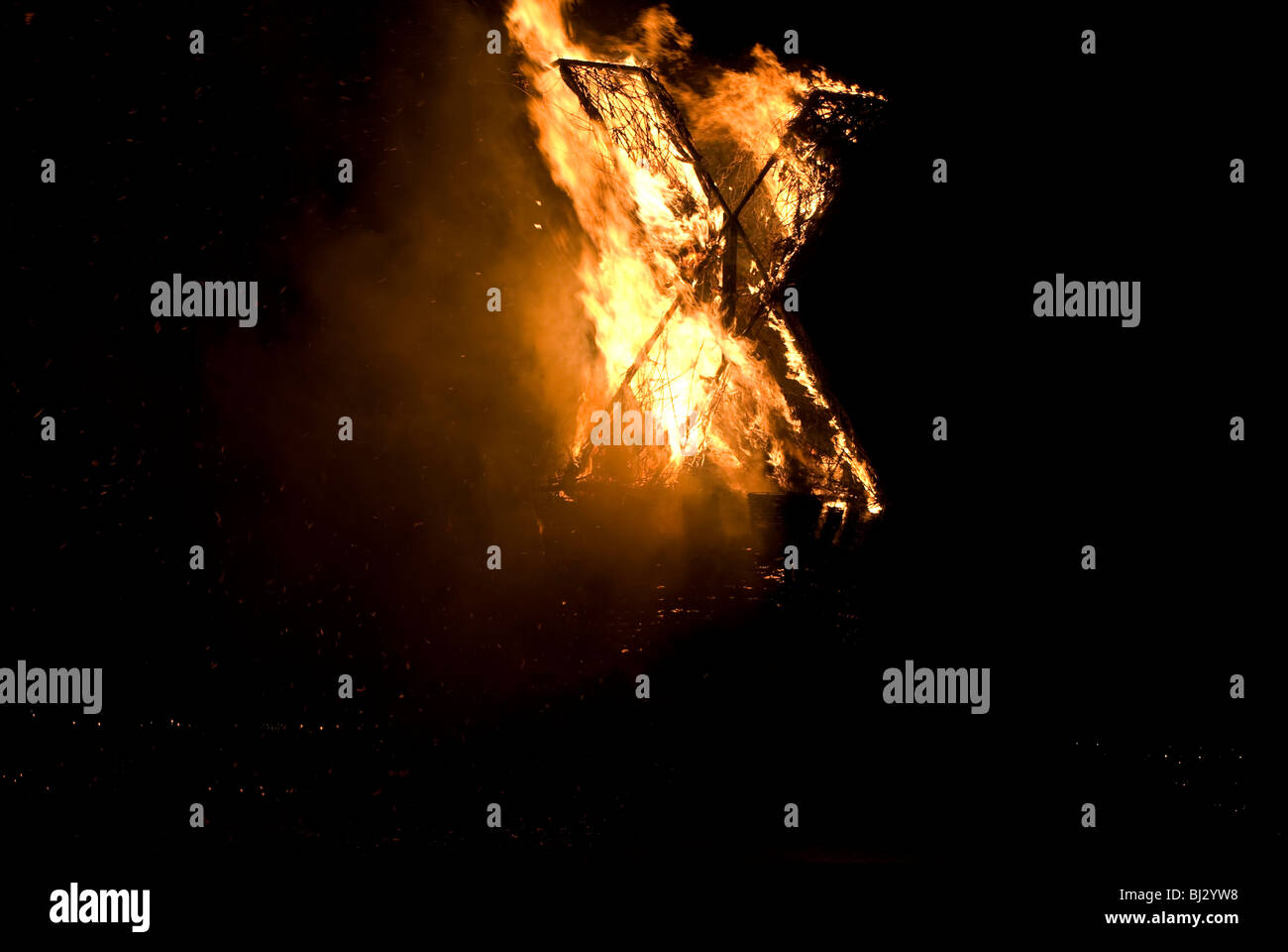 Burning a St Andrews Cross on Calton Hill, Edinburgh, Scotland, part of ...