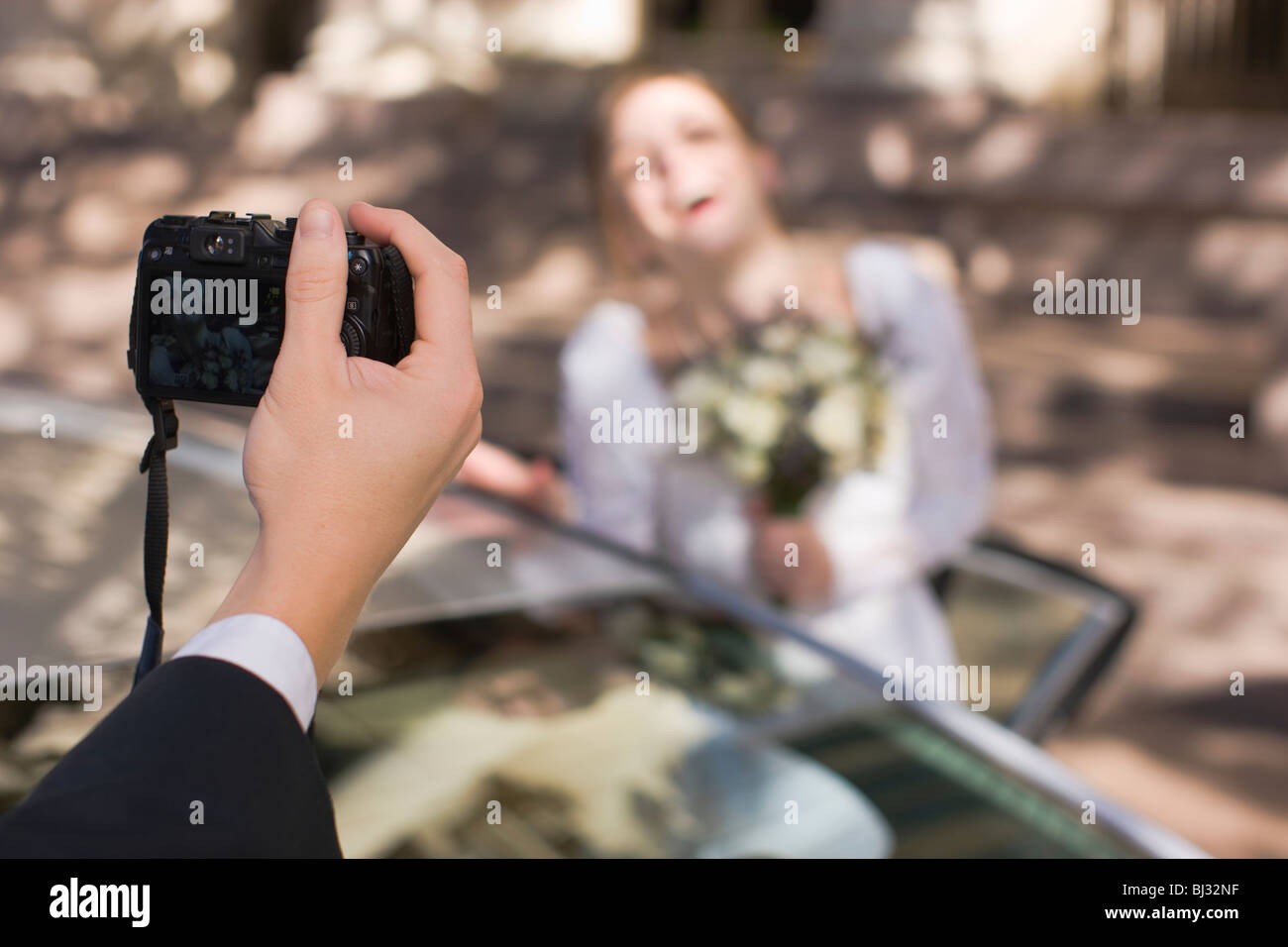 Digital camera with bride and groom hi-res stock photography and images ...