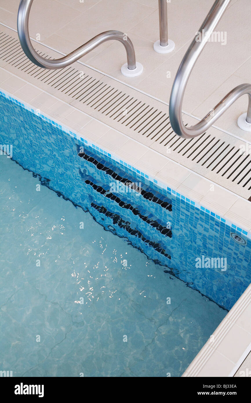 Swimming pool steps and hand rails Stock Photo - Alamy