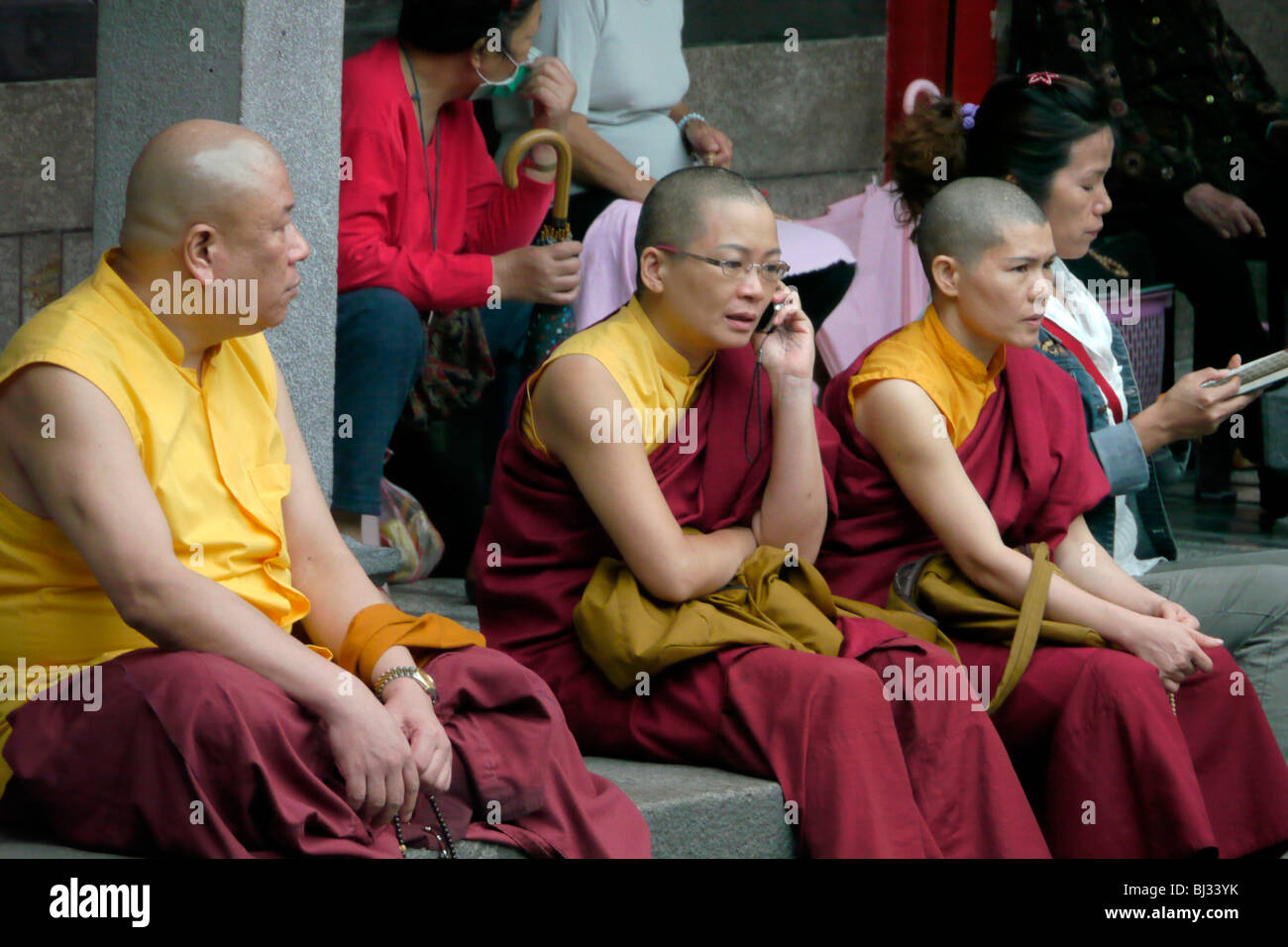 TAIWAN Lungshan temple, Taipei. Buddhist monk using cell phone ...