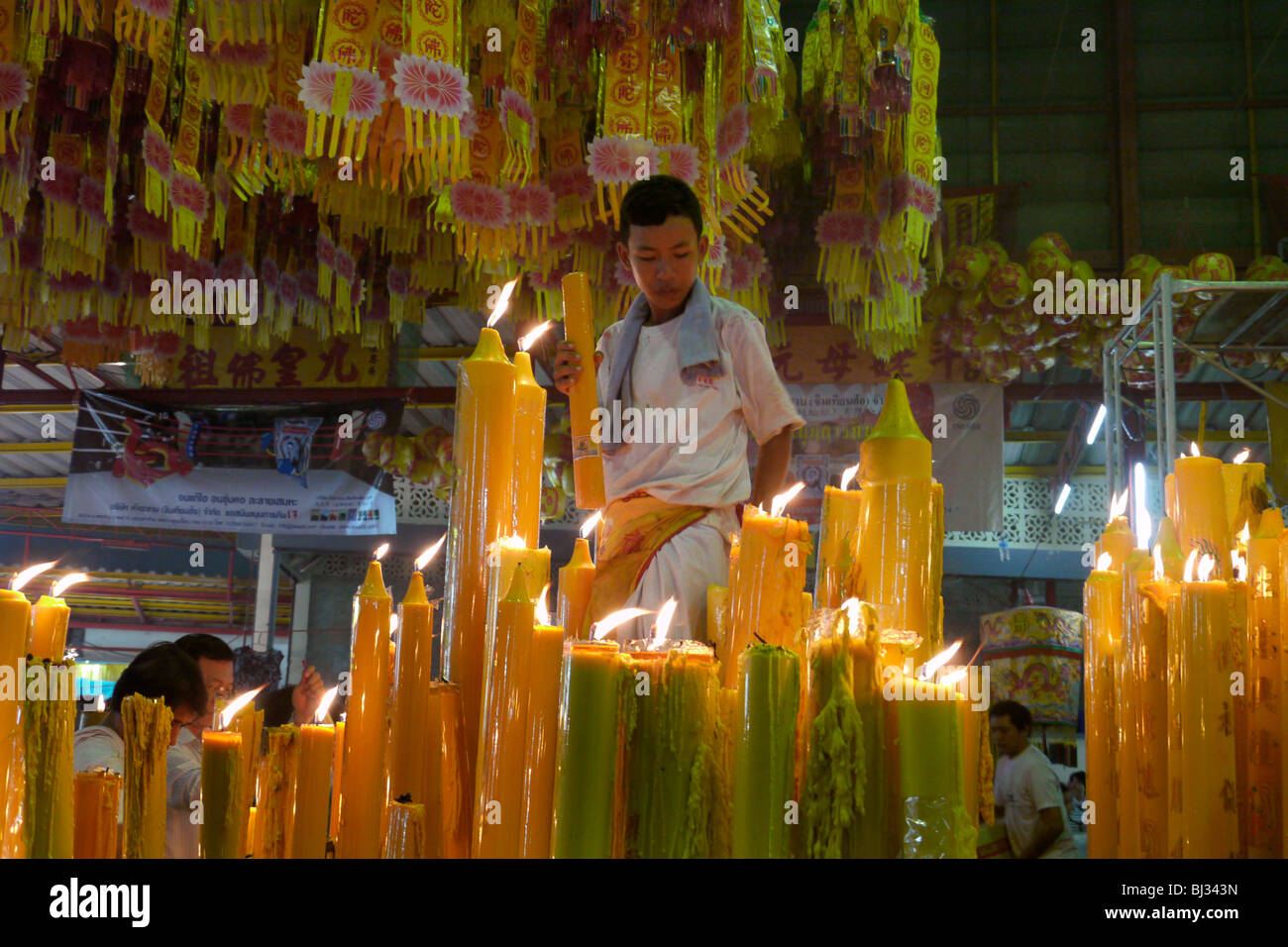 THAILAND Lighting giant candles at Chinese New Year event, Chinatown ...