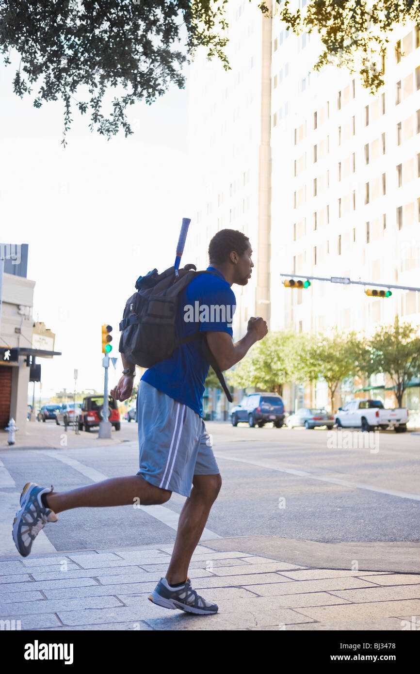 man running in urban setting Stock Photo - Alamy