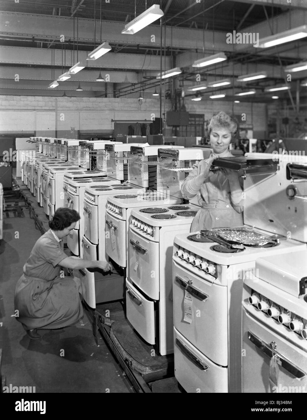 The final stages of cooker assembly at the GEC plant, Swinton, South ...