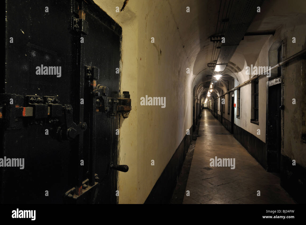 Heavy door in passage / corridor at Second World War Two Fort Breendonk ...