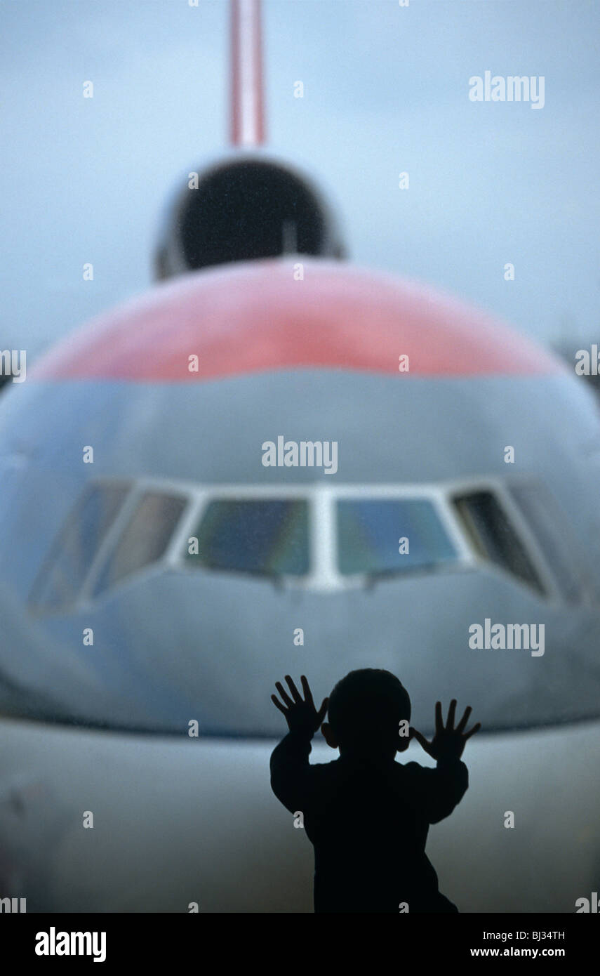 A boy spreads his hands and fingers out on a Gatwick South Terminal ...