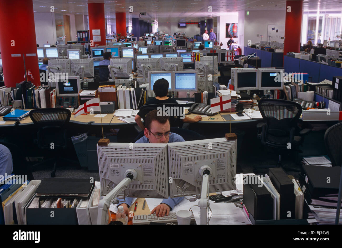 An analyst for the American energy company Enron Corporation, stares ...