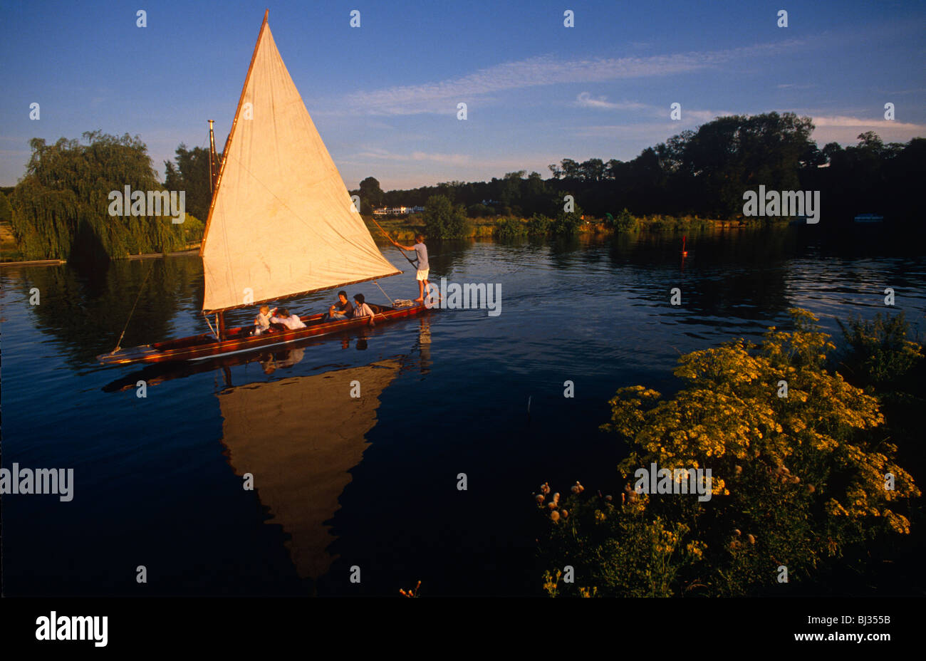 A family punts down the River Thames near the village of Shillingford ...