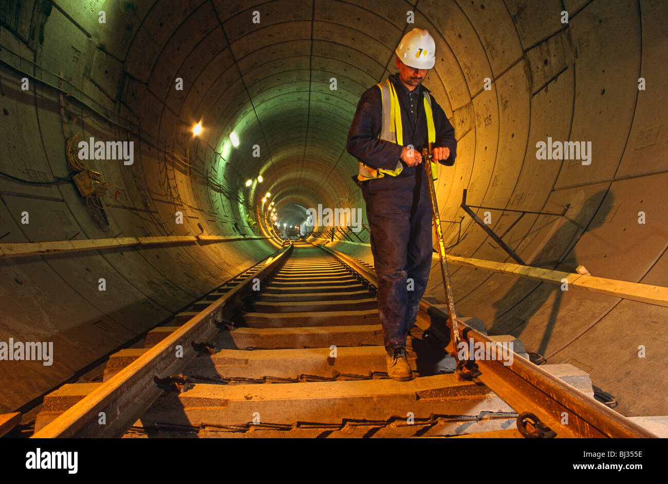 An contracted engineer working underground during construction of the Heathrow Express train ...
