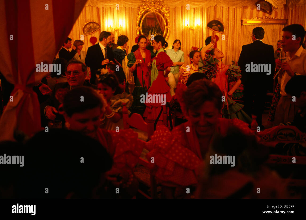 A lively group of Spanish friends, family and corporate clients gather ...