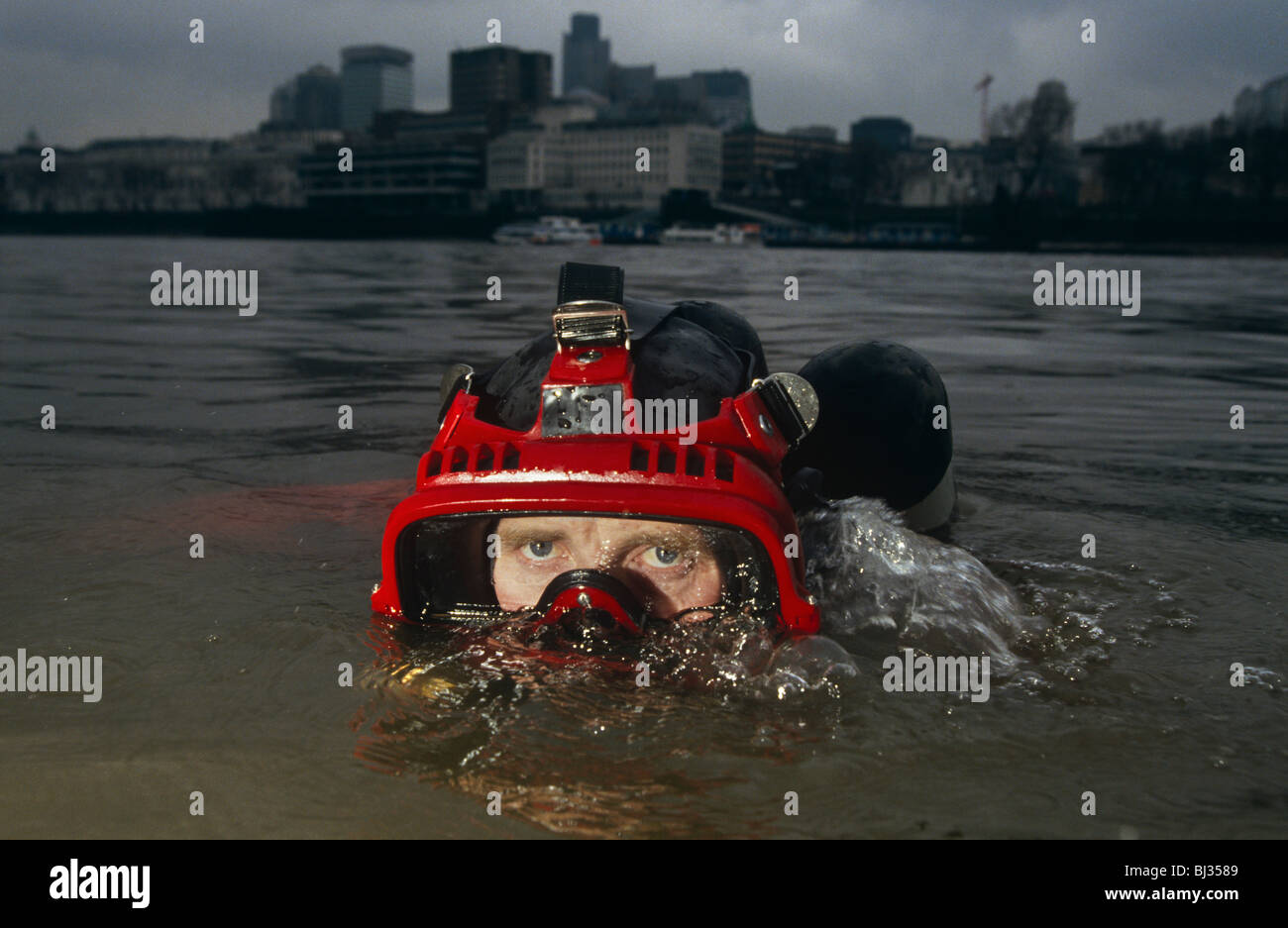 Metropolitan Police diver surfaces beneath the murky waters of the ...