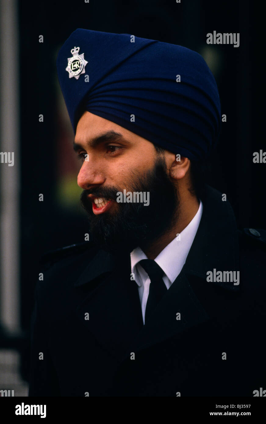 A Metropolitan police officer of the Sikh faith stands outside ...
