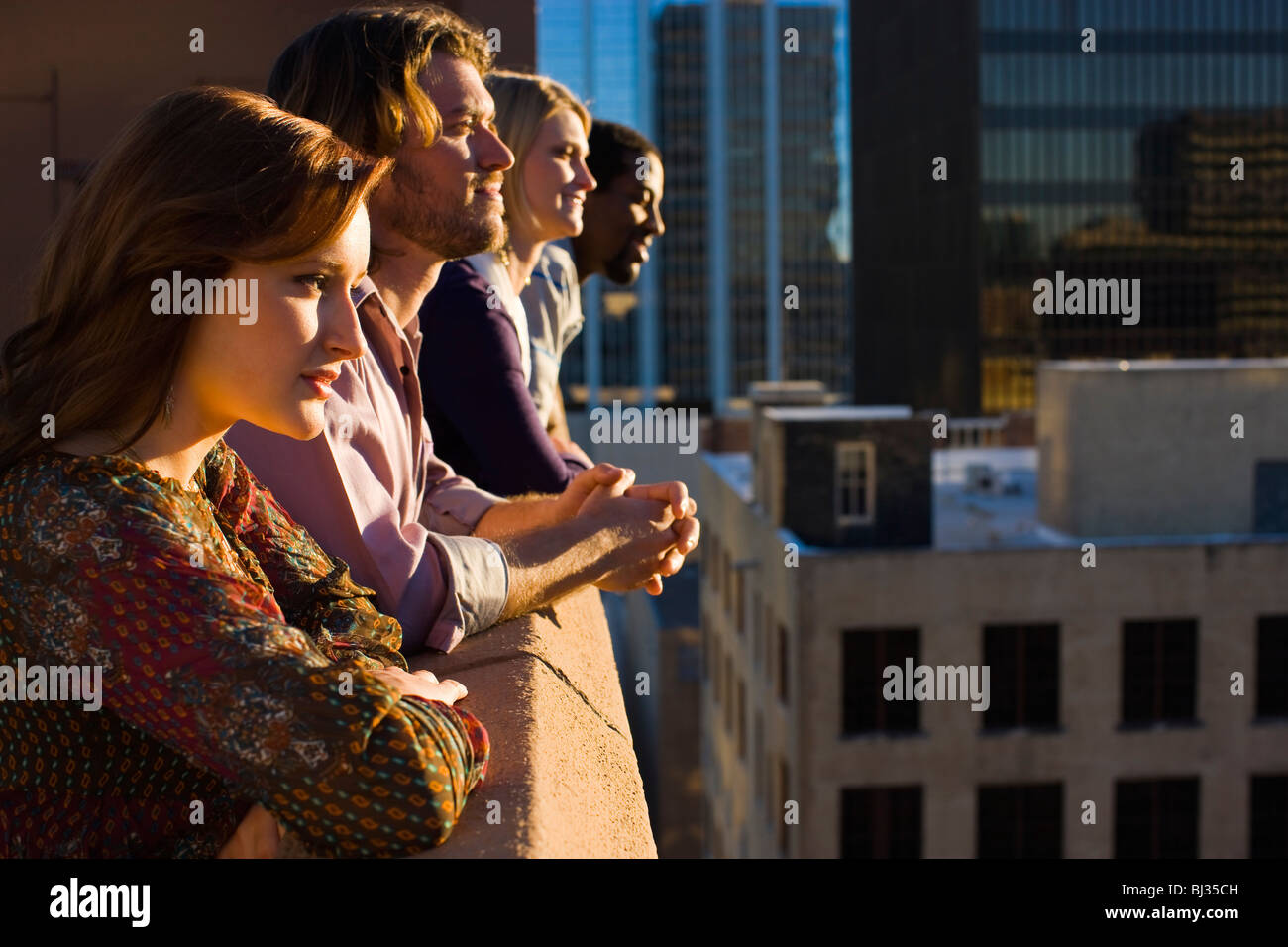 Friends on roof top in hi-res stock photography and images - Alamy
