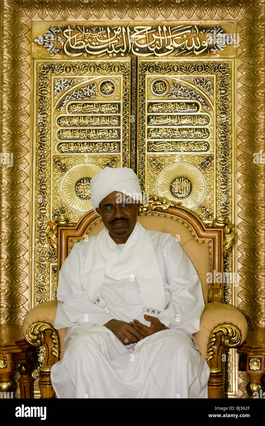 Sudanese President, Omar Hassan Ahmad al-Bashir is seated against a ...