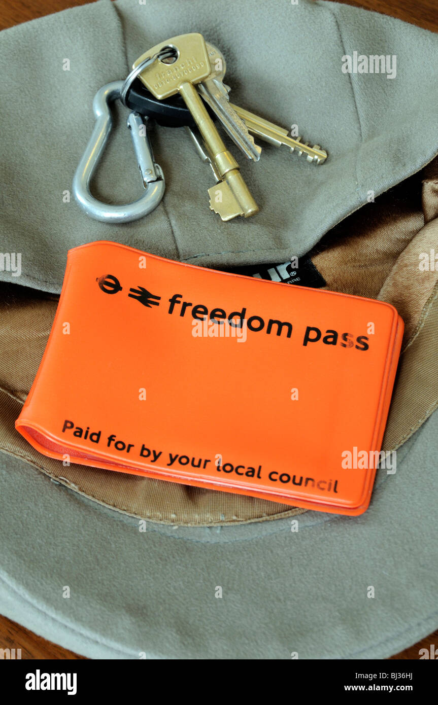 Freedom Pass for the over 60's with keys in old cap Stock Photo - Alamy