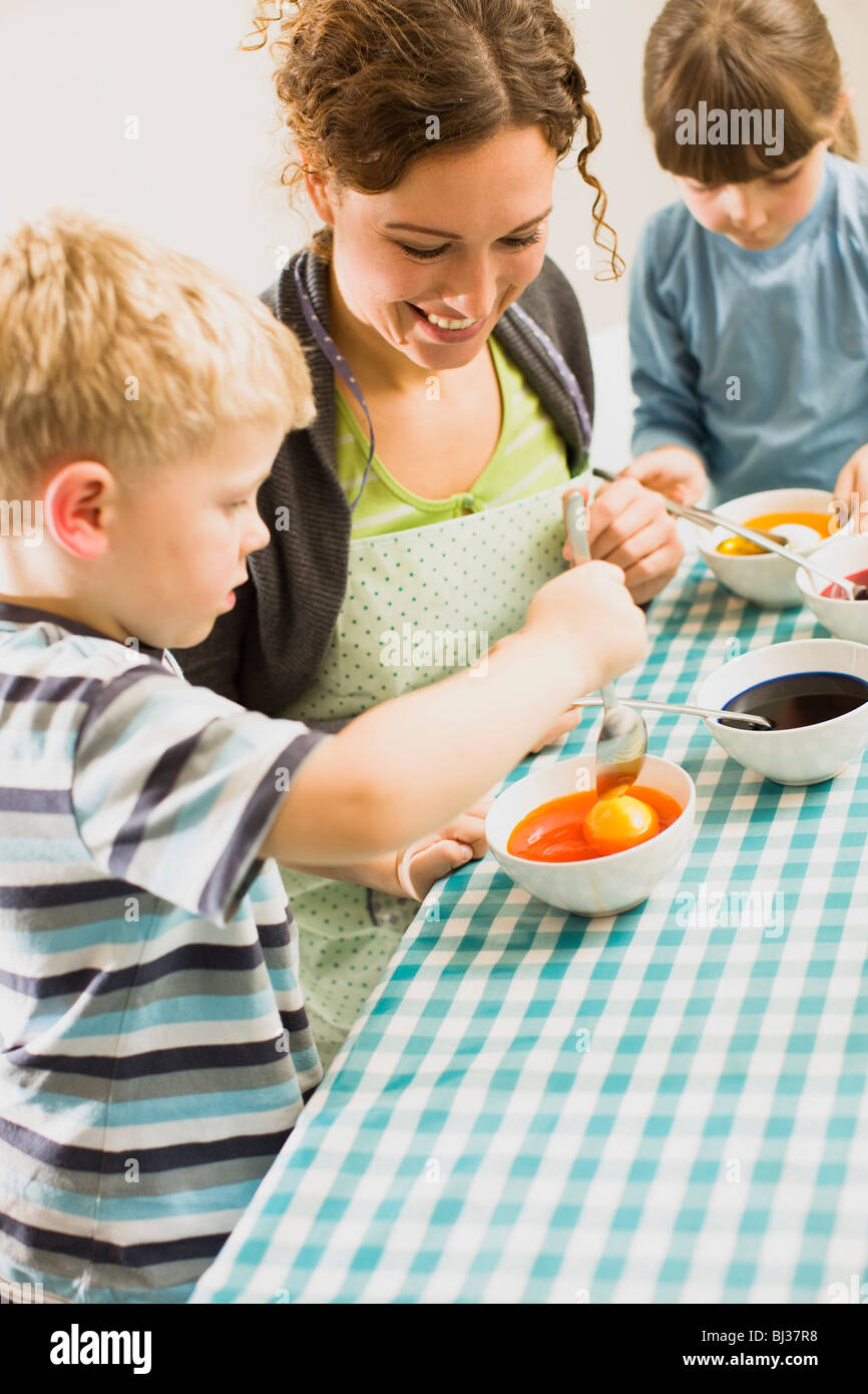 family doing Easter arrangements Stock Photo - Alamy