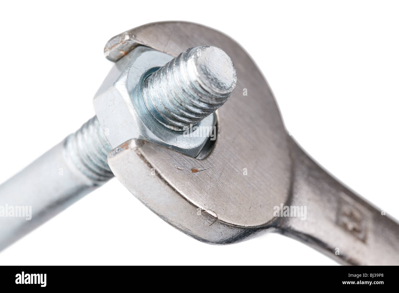 chrome spanner with nut and bolt on white background Stock Photo - Alamy