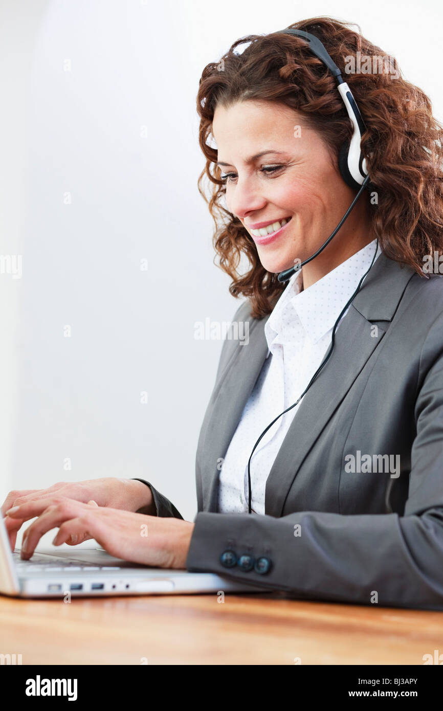 female call center agent typing Stock Photo - Alamy