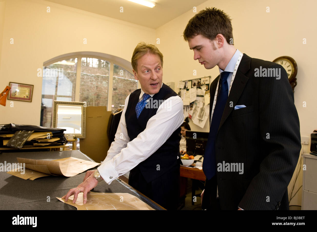 Master tailor Thomas Mahon teaching his new apprentice the trade of ...