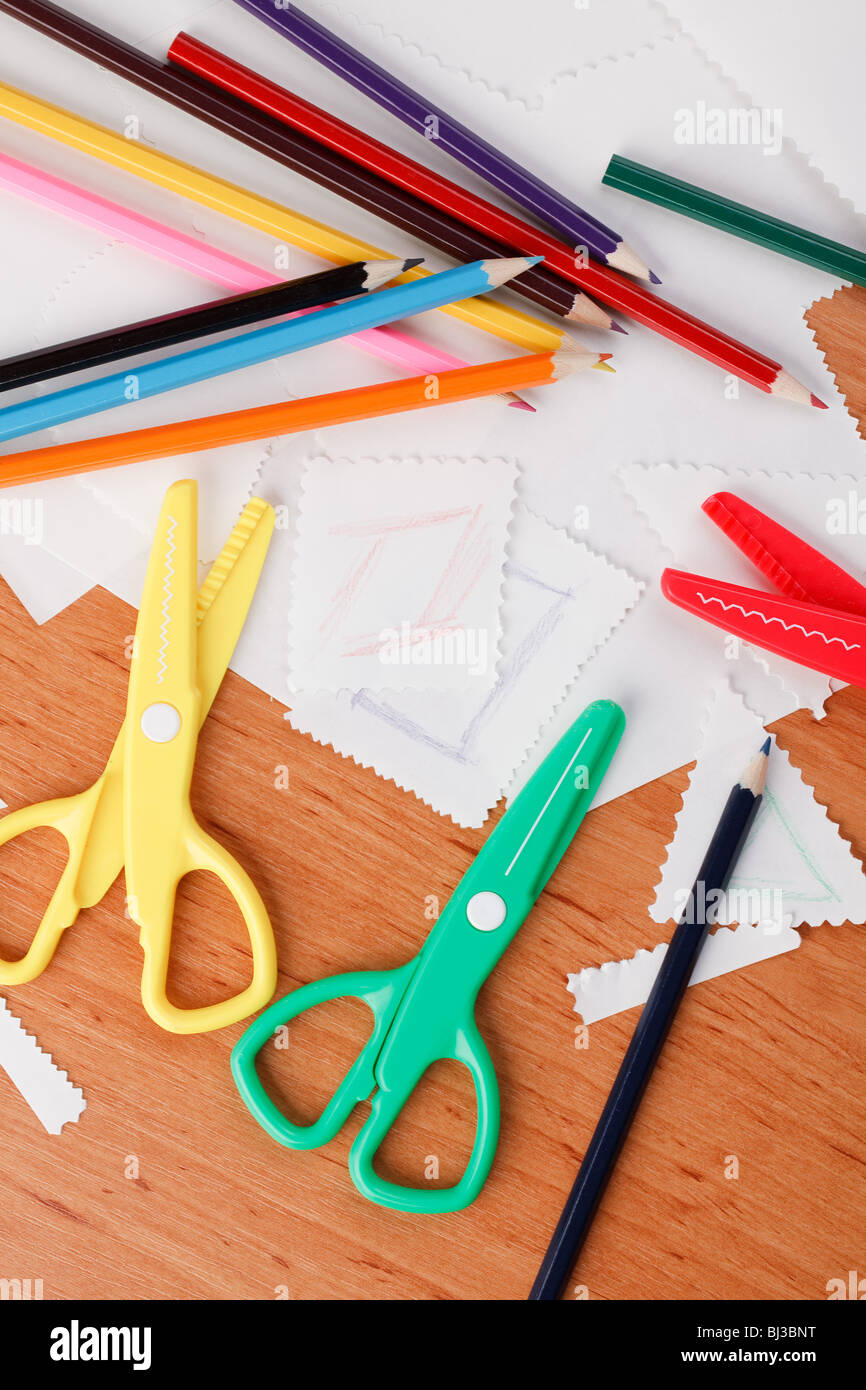 colourful scissors and crayons on table Stock Photo - Alamy