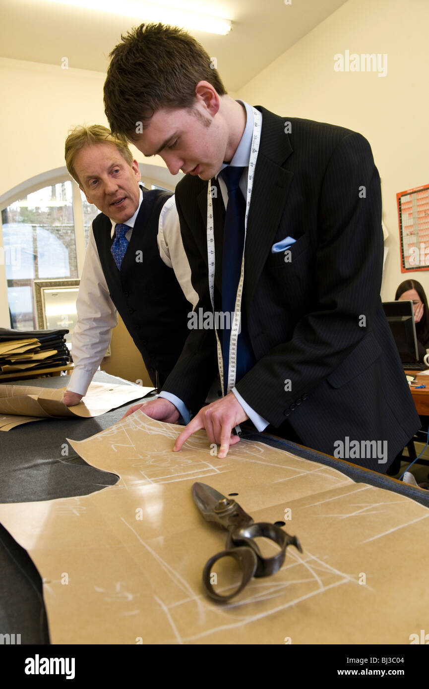 Master tailor Thomas Mahon instructing his new apprentice the trade of ...